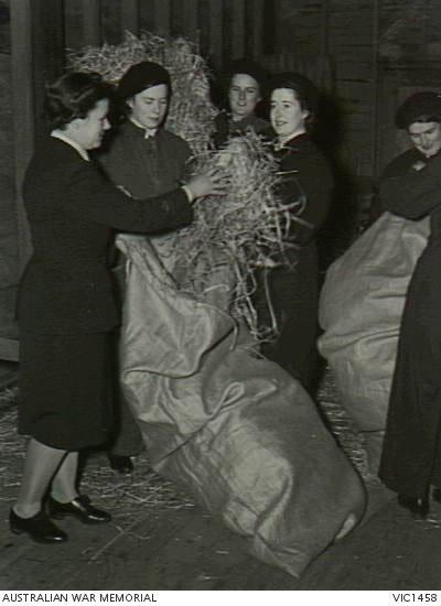 West Melbourne, Vic. C. 1941. Four WAAAF recruits being instructed in ...