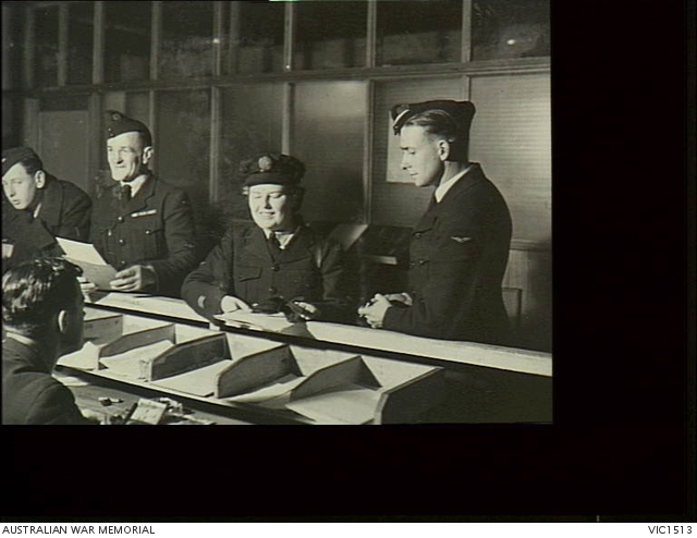 Melbourne, Vic. C. 1945. A WAAAF airwoman, two RAAF aircrew trainees ...