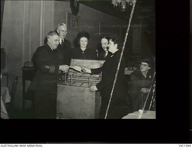 Melbourne, Vic. A RAAF Group Captain accepting a cheque and a water ...