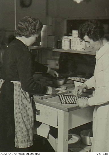 Melbourne, Vic. 1945-07-24. A WAAAF airwoman (left) receiving ...