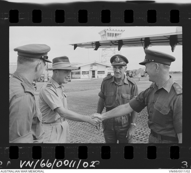 Three Army commanders greet O33113 Group Captain (Gp Capt) Peter Frank ...