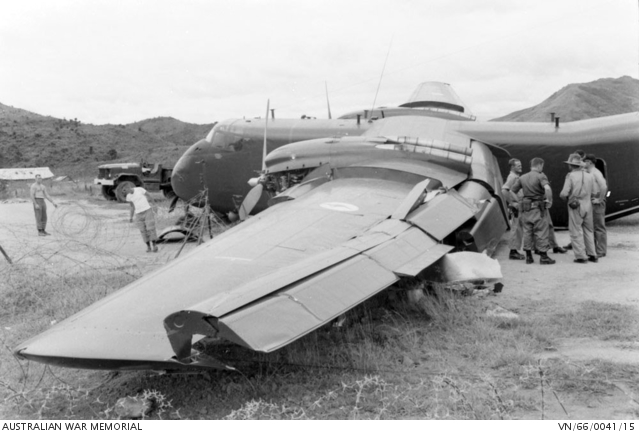 Several unidentified men from No 35 Squadron, RAAF, stand around the ...