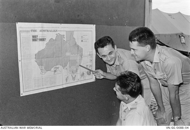 Three members of the RAAF Contingent at Vung Tau look up the electoral ...