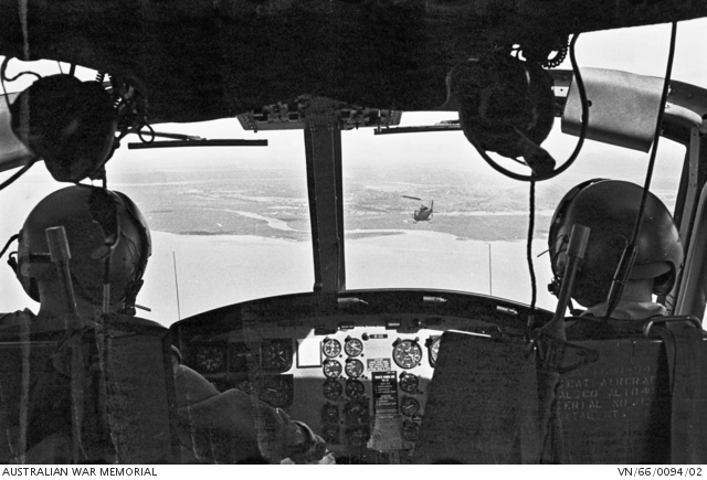 Two unidentified pilots of No 9 Squadron, RAAF, seen from behind, in ...
