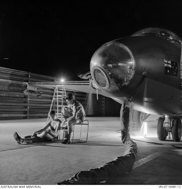 A moments rest under the wing of a No 2 Squadron Canberra bomber ...