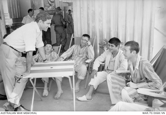 Four soldiers sitting in chairs convalescing at the 1st Australian ...