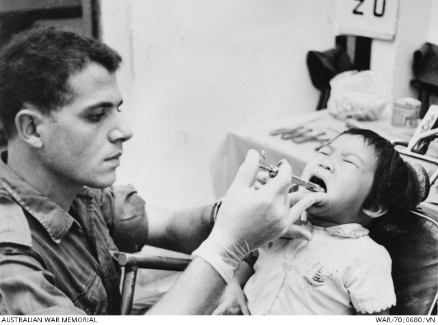 Captain (Capt) George Nichols from West End, Brisbane, Qld, administers ...