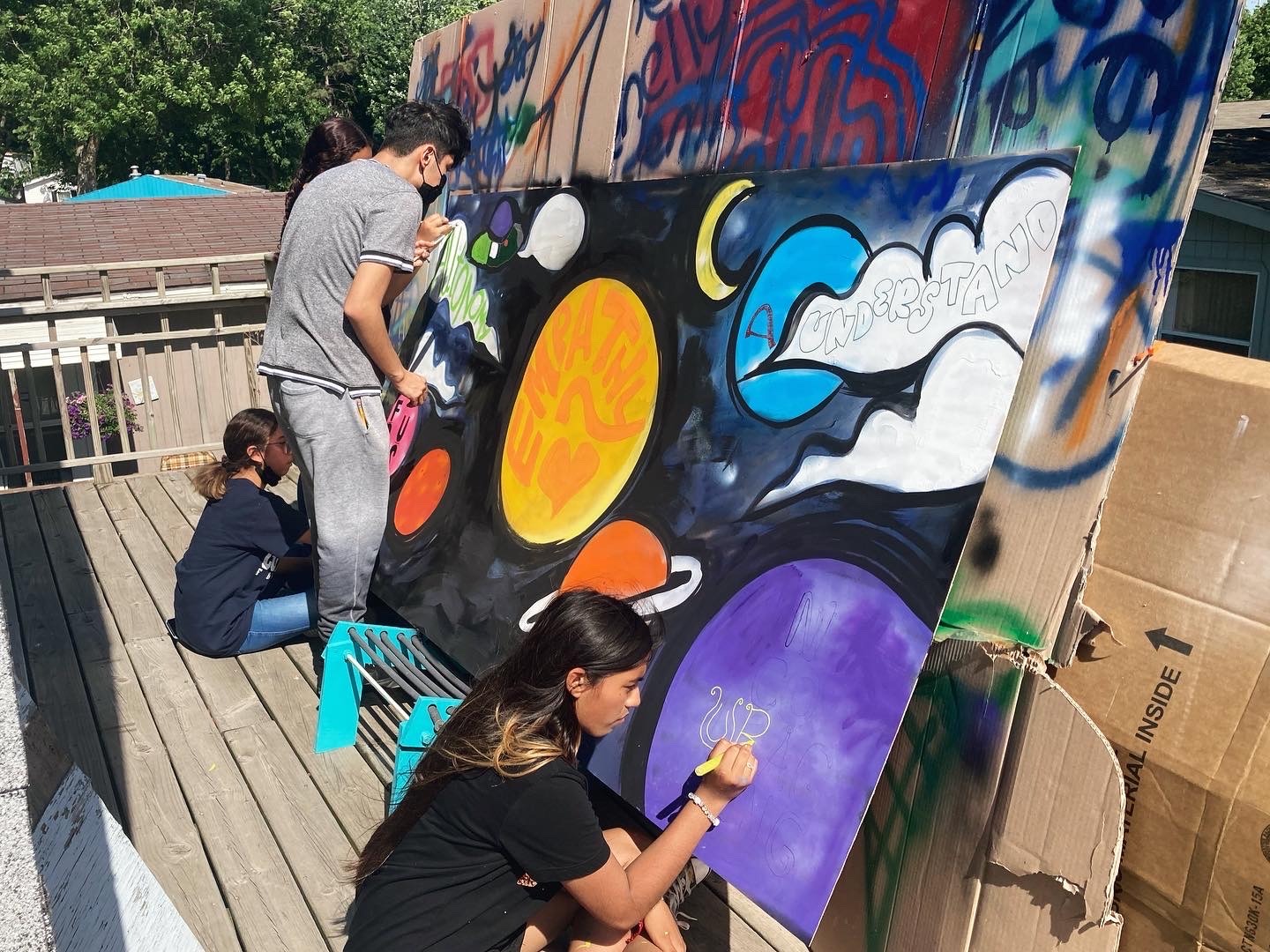 How to spray paint a mural by Locust Street Productions in New York
