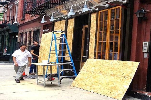 Boarding up windows, stacking sandbags as hurricane nears Florida ...